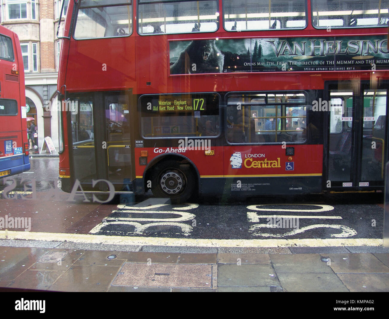 London buses on a rainy day as seen from inside a coffee shop, UK Stock ...
