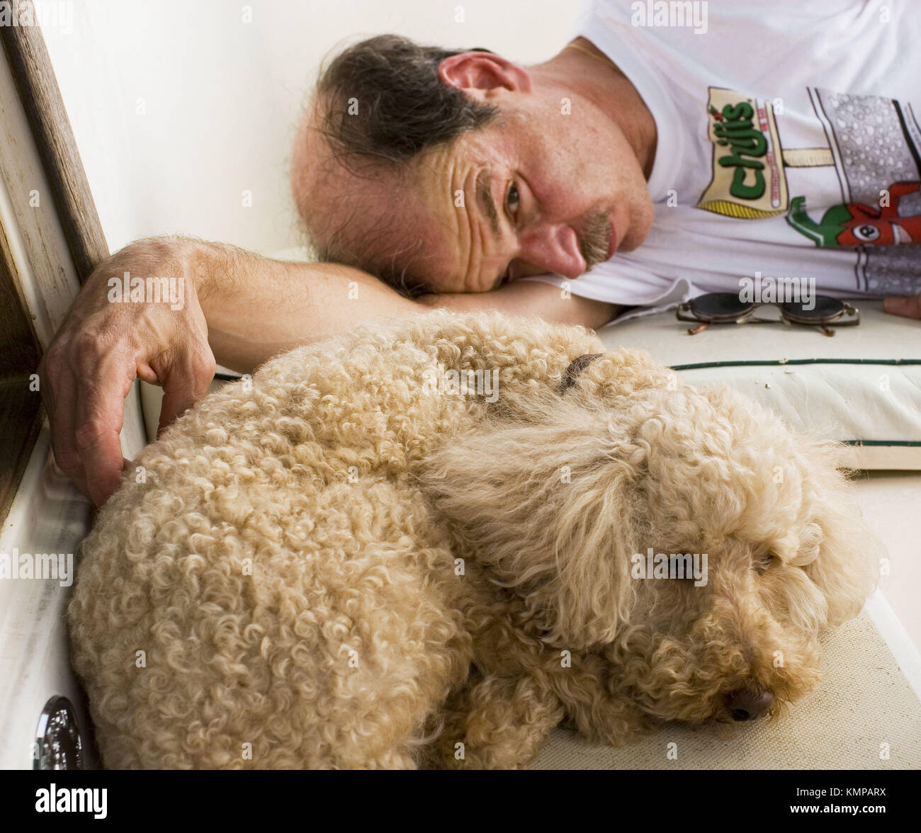 Man sleep with dog hi-res stock photography and images - Alamy