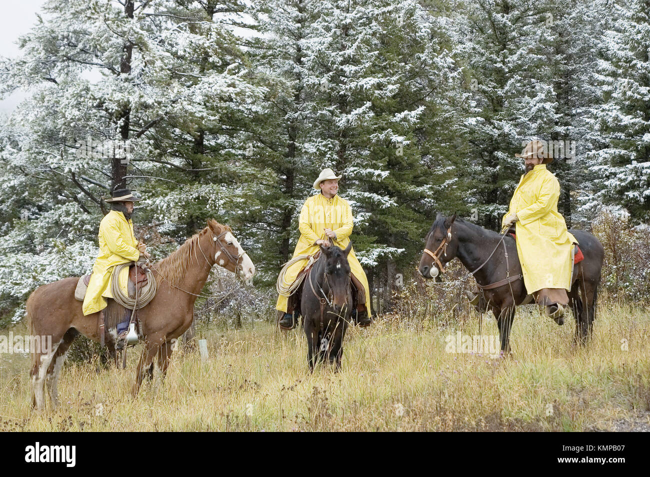Three cowboys on horseback hi-res stock photography and images - Alamy