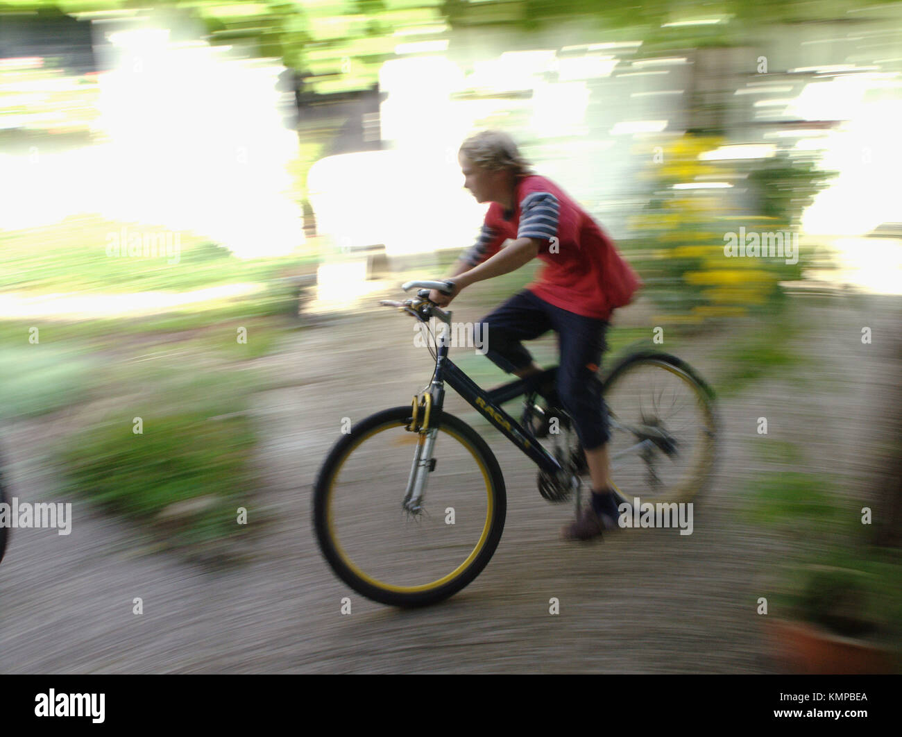 Boy driving a bicycle hi-res stock photography and images - Alamy