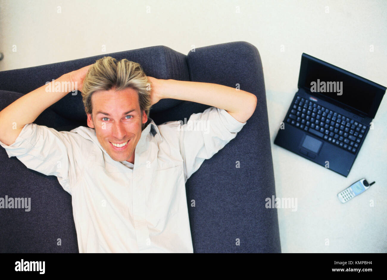 Businessman looking at camera Stock Photo - Alamy