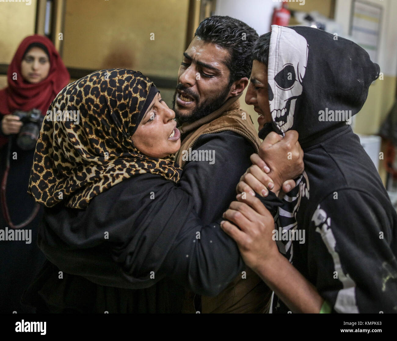Relatives mourn the death of Maher Attala at the Indonesian hospital in ...