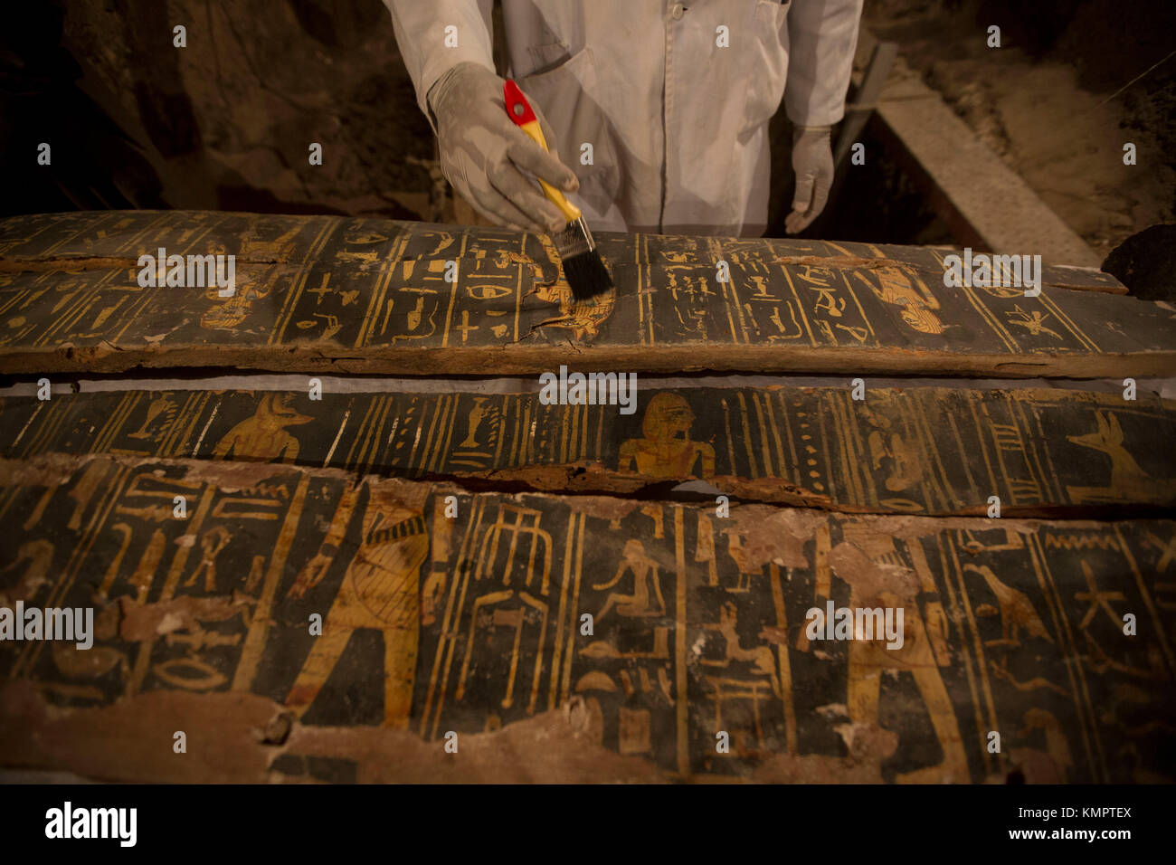 Egyptian archeologists work in a newly discovered tomb in Luxor, Egypt ...