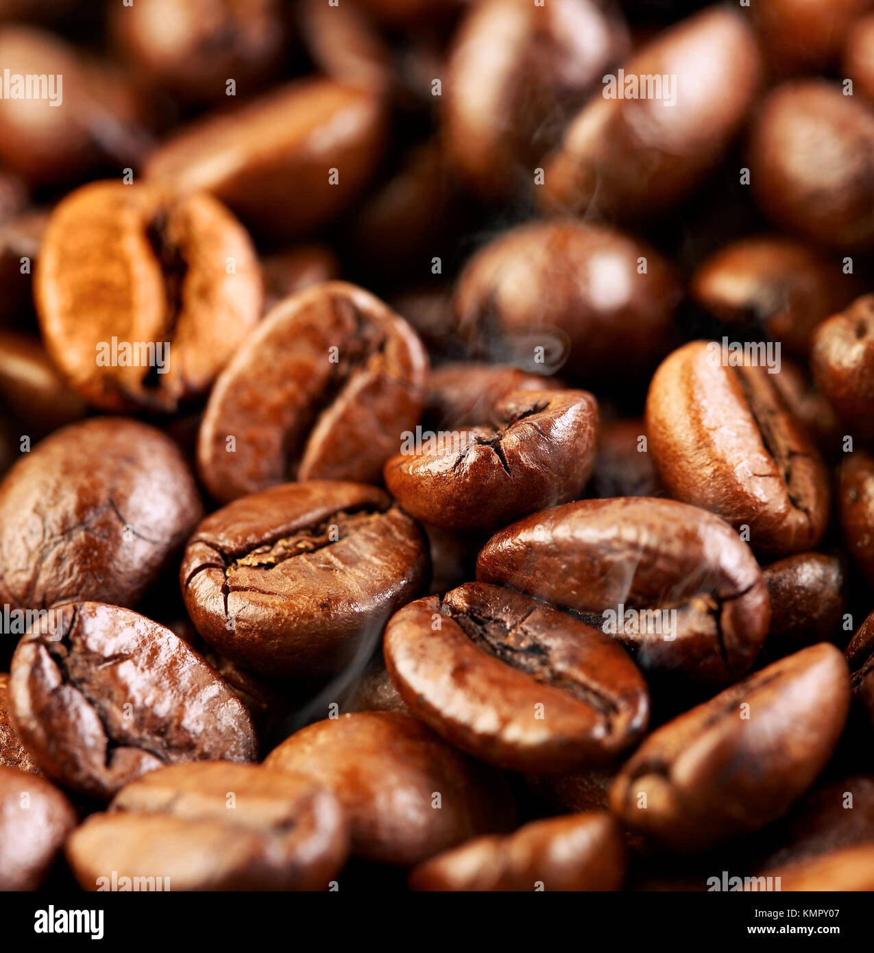 Fragrant fried coffee beans a-smoke Stock Photo - Alamy