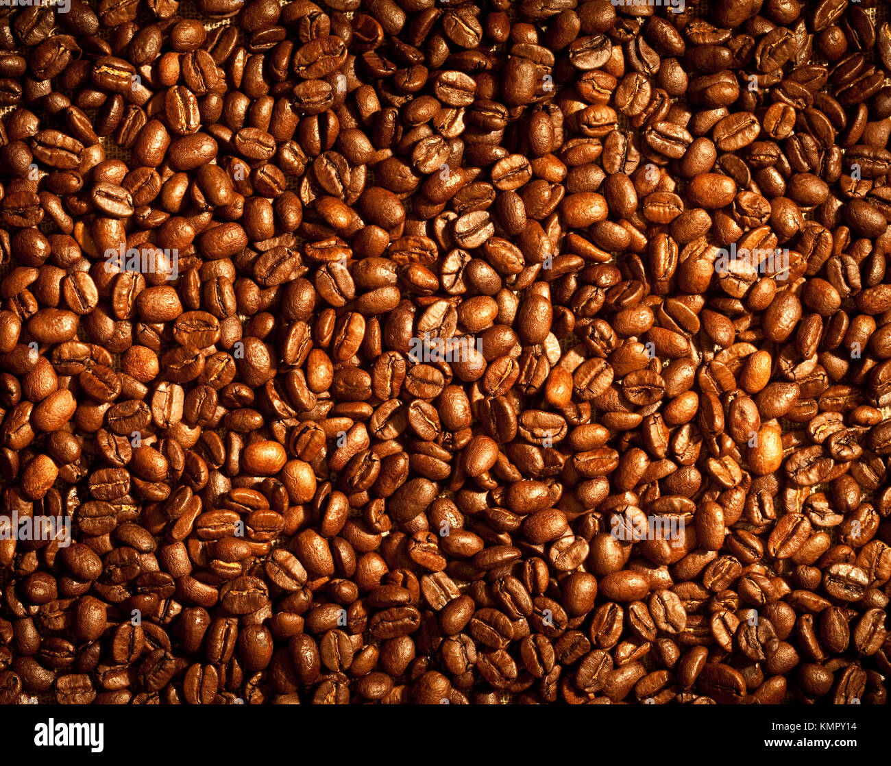 Fragrant fried coffee beans background Stock Photo - Alamy
