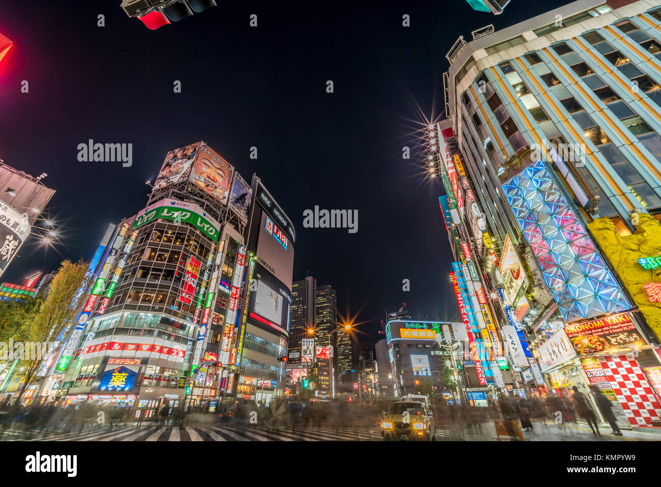 Colorful busy Street and Billboards. Motion blurred People passing ...