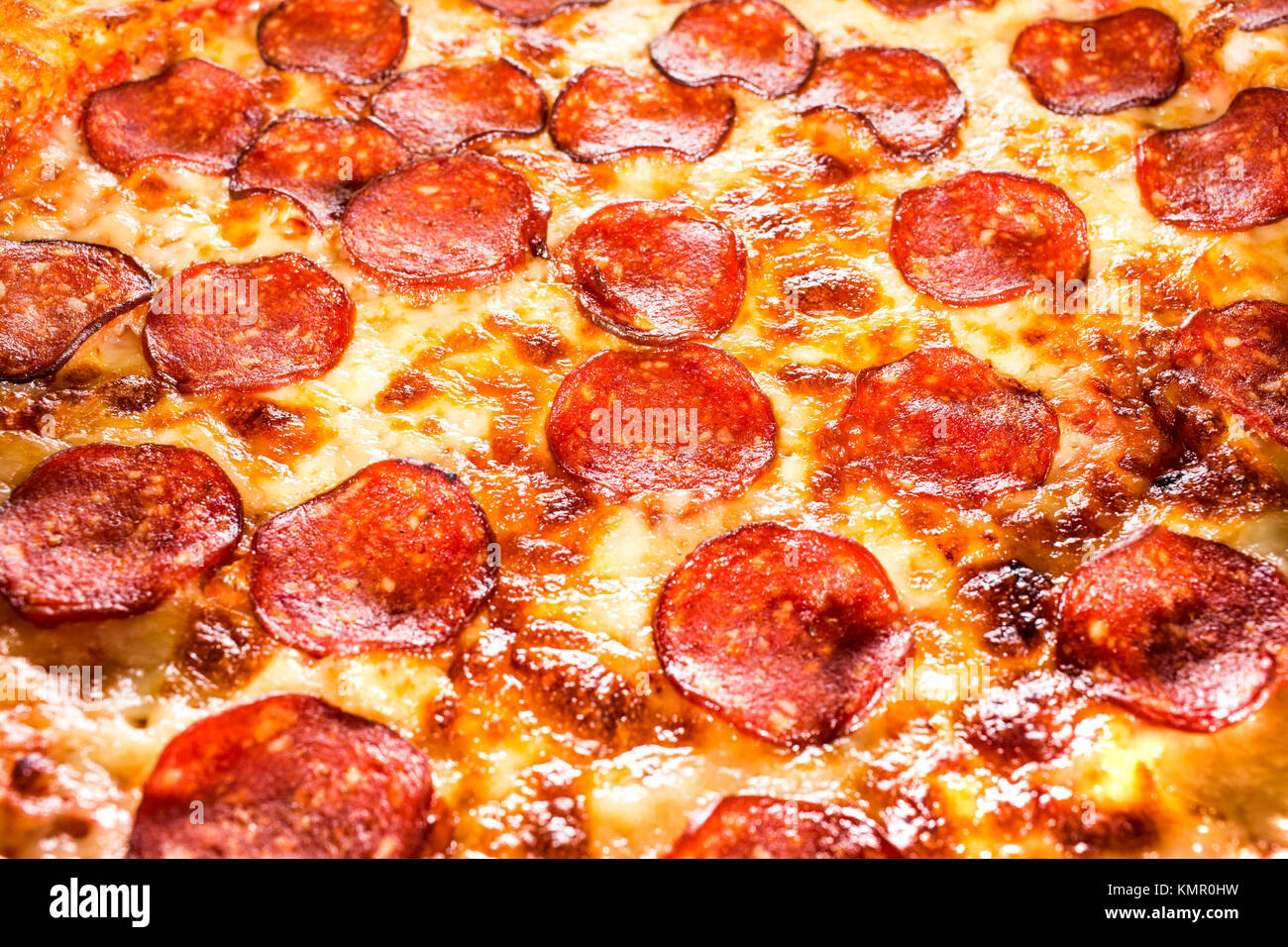 Appetizing background pepperoni pizza closeup filling the frame Stock ...