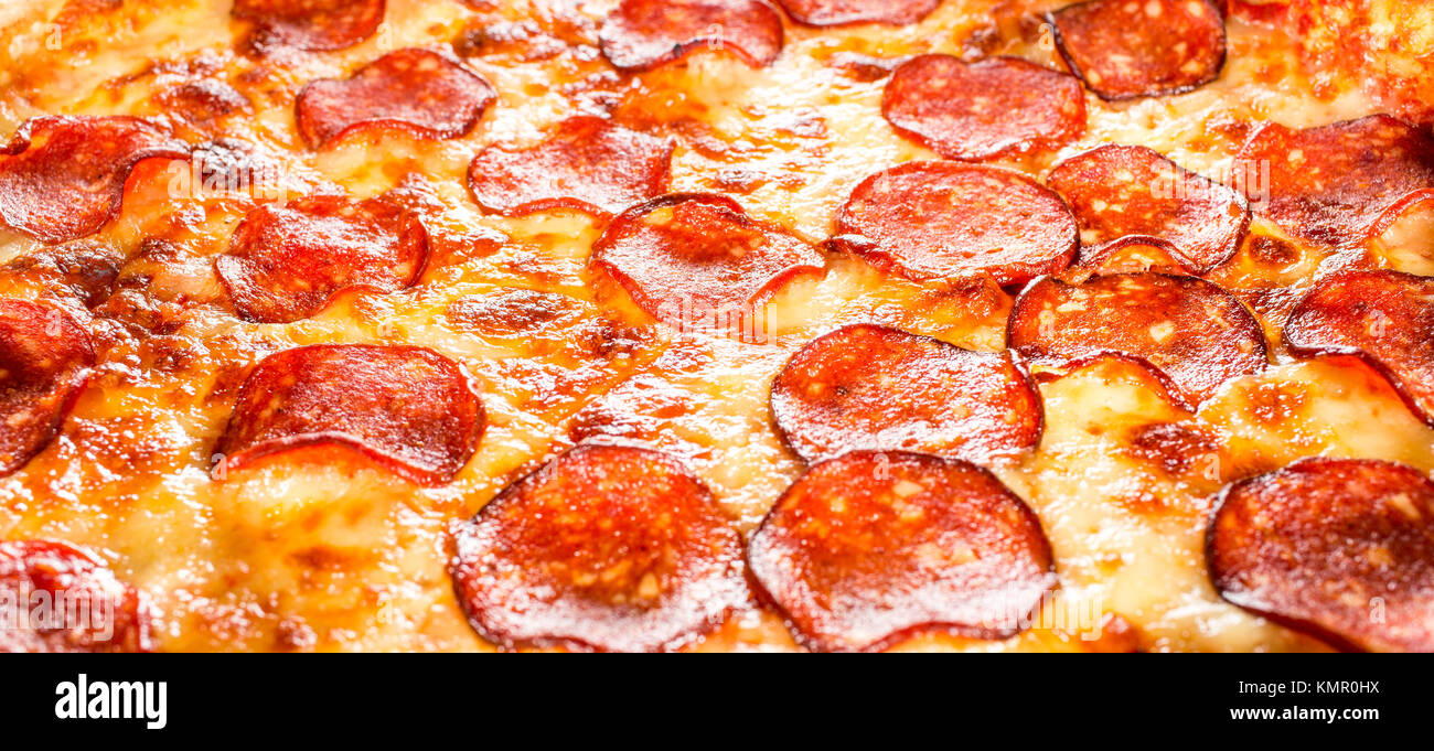 Appetizing background pepperoni pizza closeup filling the frame Stock ...
