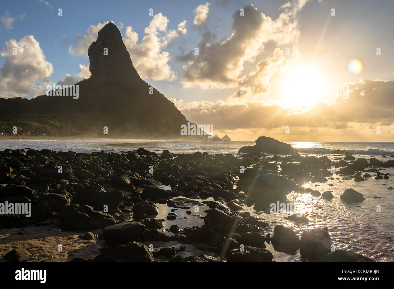 Praia da conceicao at sunset with morro do pico hi-res stock ...
