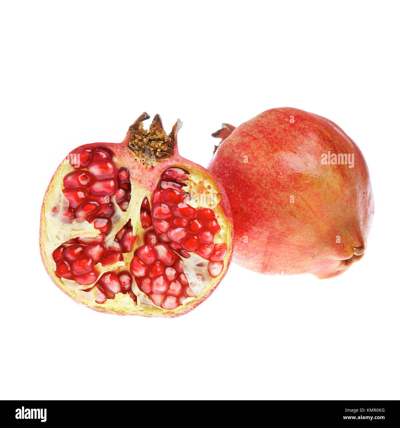 Organic pomegranate on tree Cut Out Stock Images & Pictures - Alamy