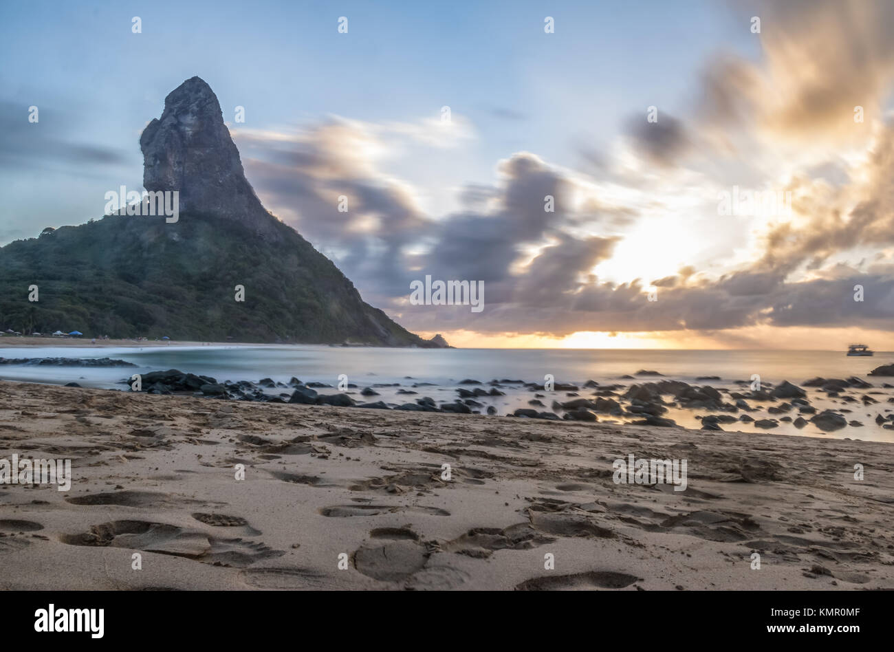 Sunset at Praia da Conceicao Beach with Morro do Pico on background ...