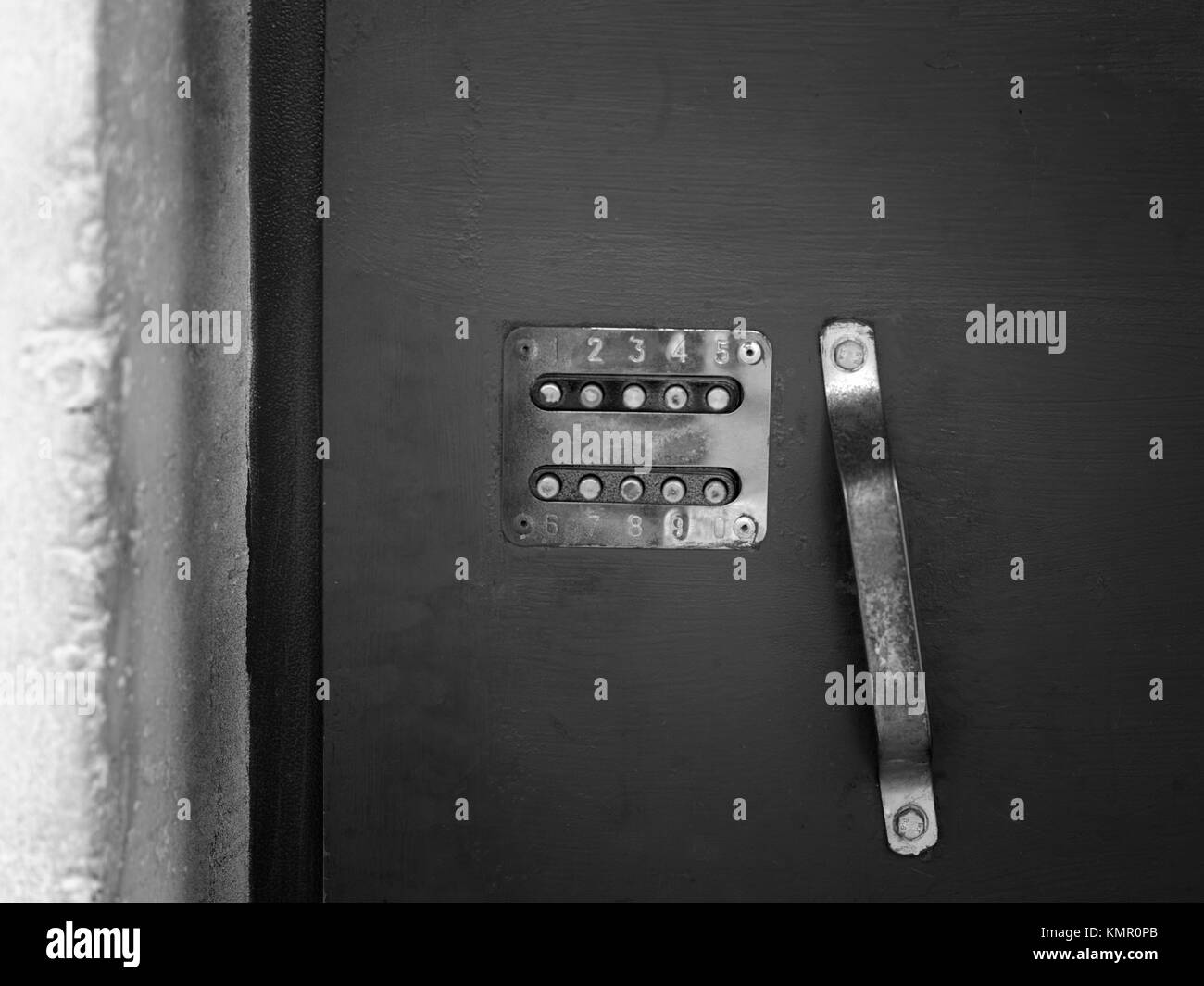 Metal door with primitive security code lock, in black and white Stock ...