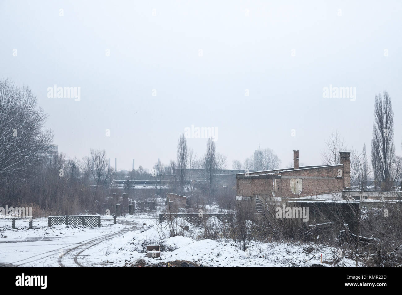 Abandoned factories and warehouses under the snow in Eastern Europe, in ...
