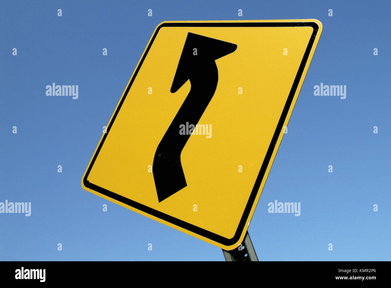Curve in road street sign Stock Photo - Alamy