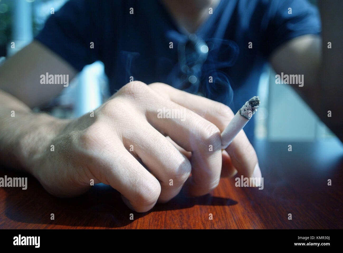 Man inside cigarette hi-res stock photography and images - Alamy