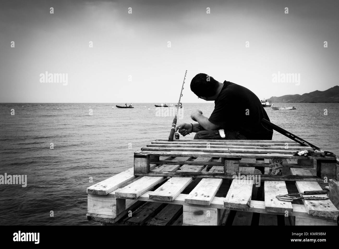 Man cooking fish on boat hi-res stock photography and images - Alamy
