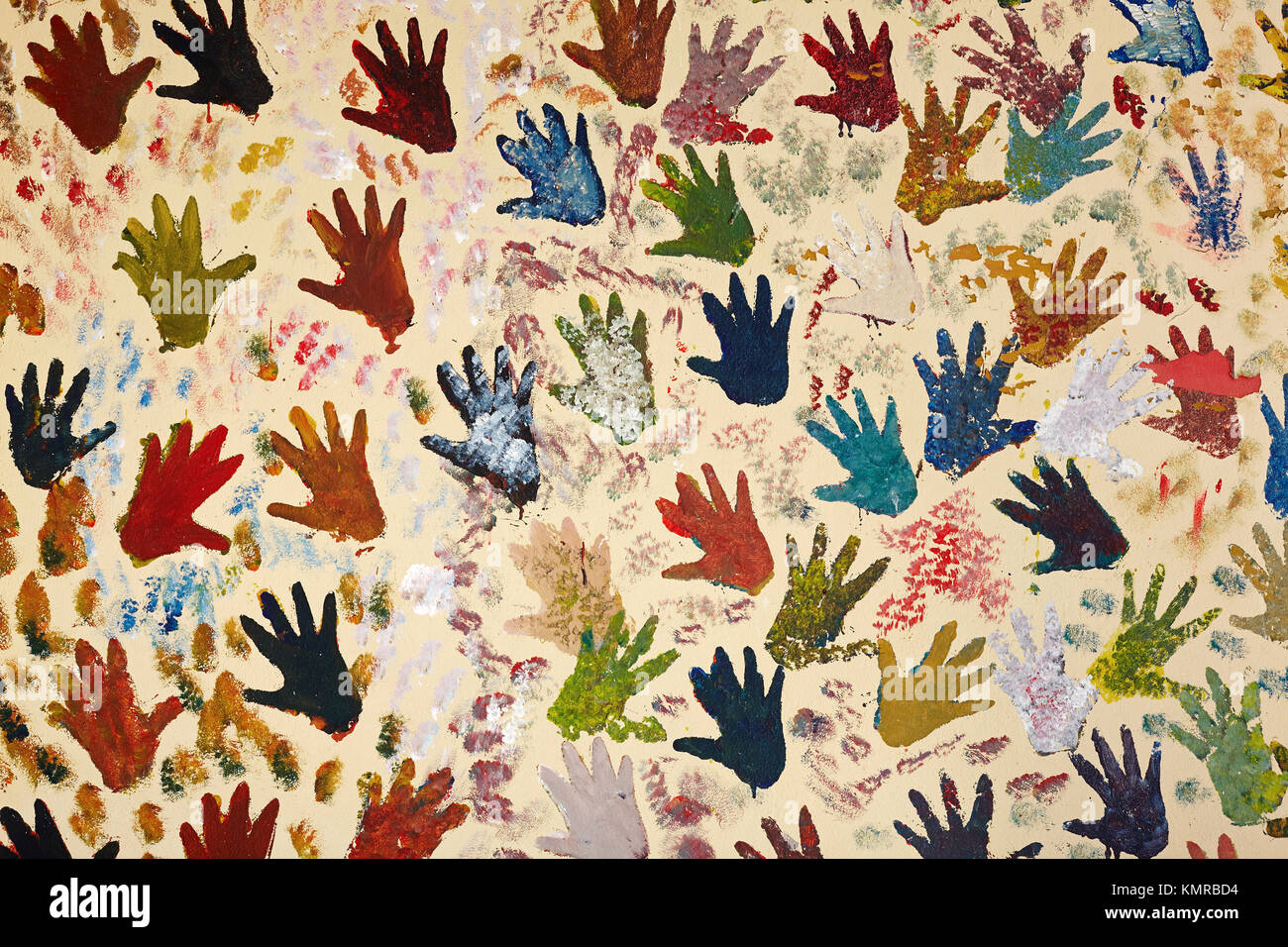 Wall painted with several hand palm marks Stock Photo - Alamy