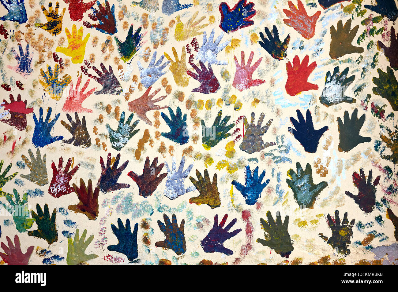 Wall painted with several hand palm marks Stock Photo - Alamy