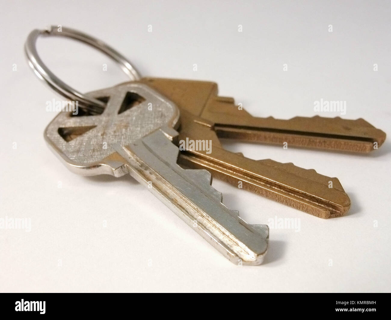 Three keys on a key ring Stock Photo - Alamy