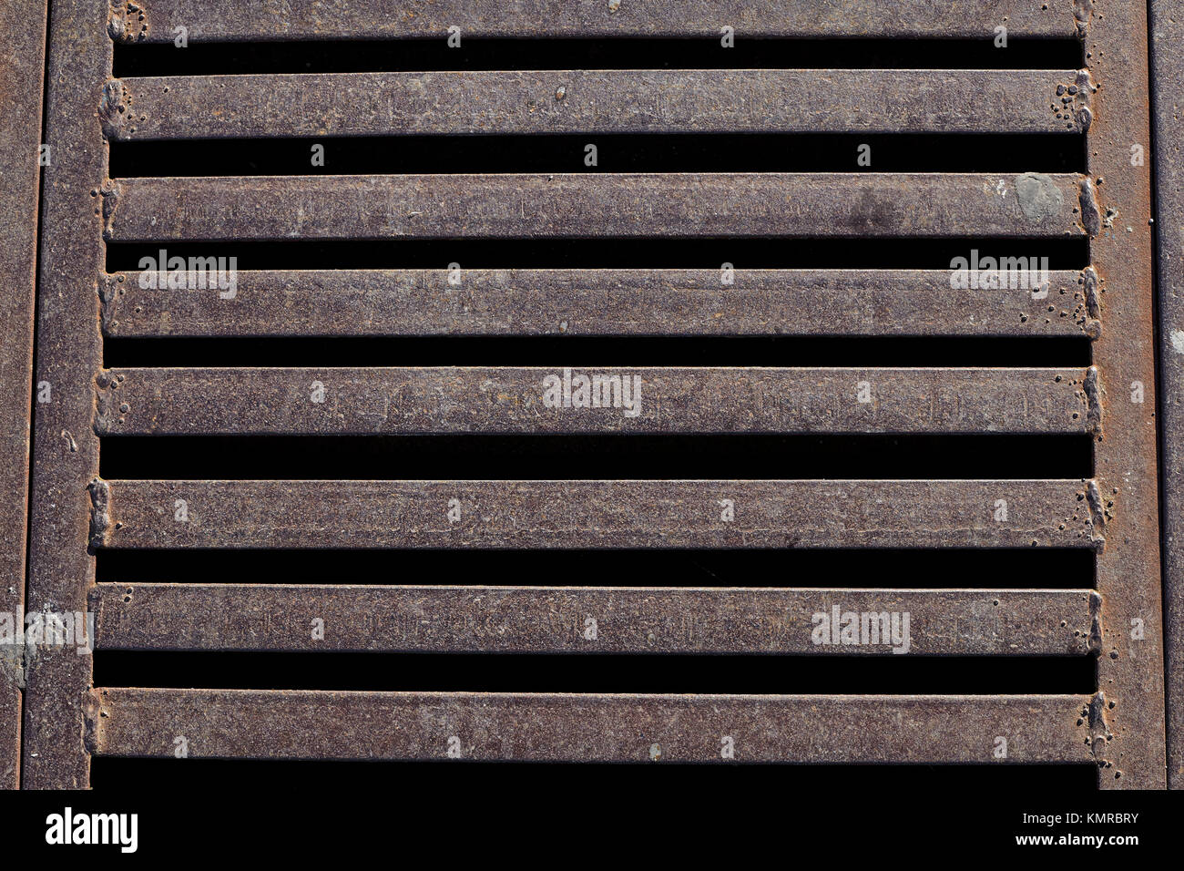 Close up of rusty iron grate on the road Stock Photo - Alamy