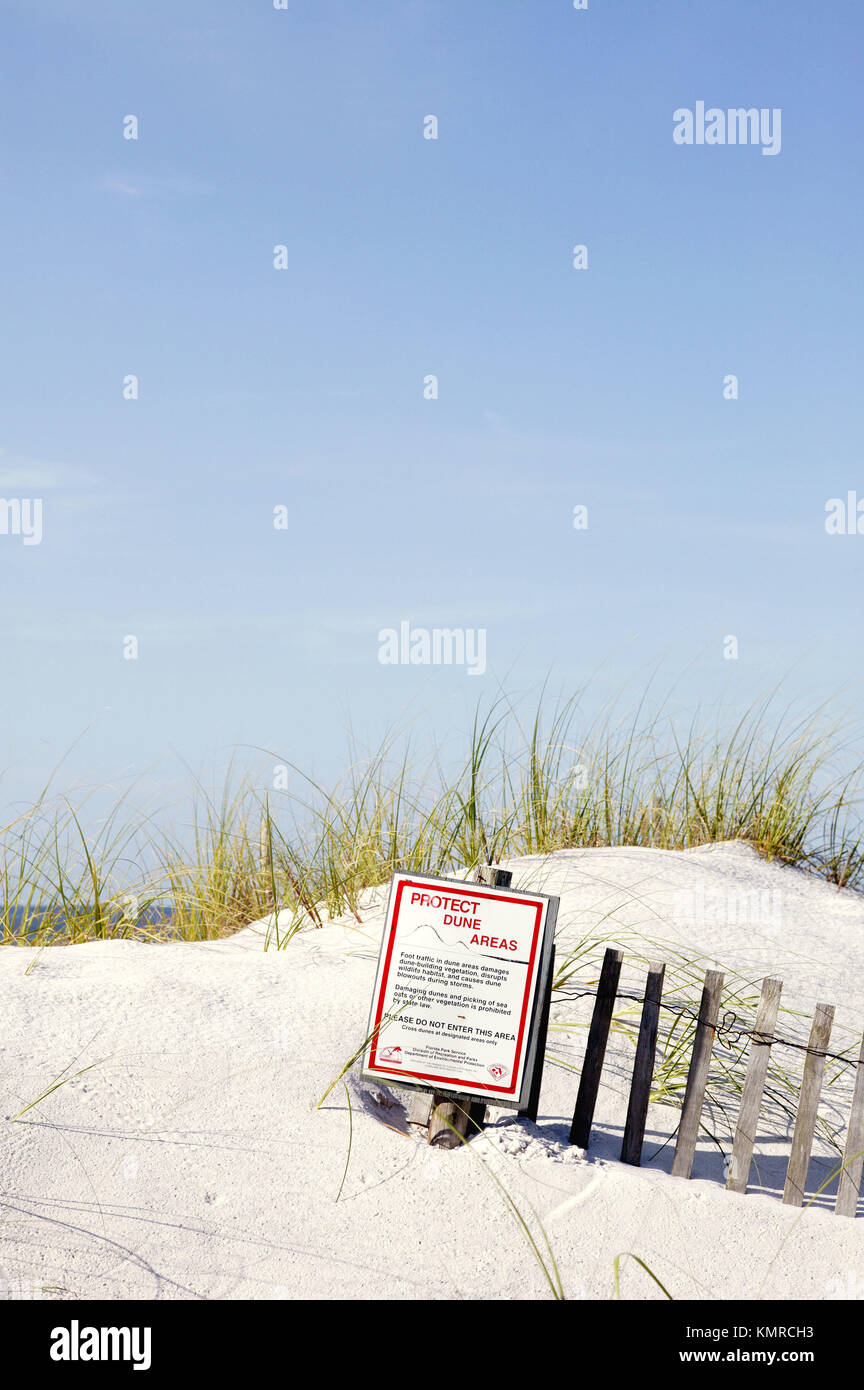 Warning sign in sand dunes Stock Photo - Alamy