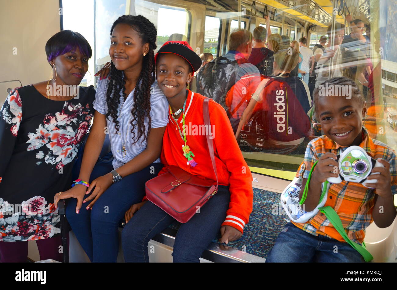 Afro-Caribbean family on the train in Orlando, Florida, USA Stock Photo ...