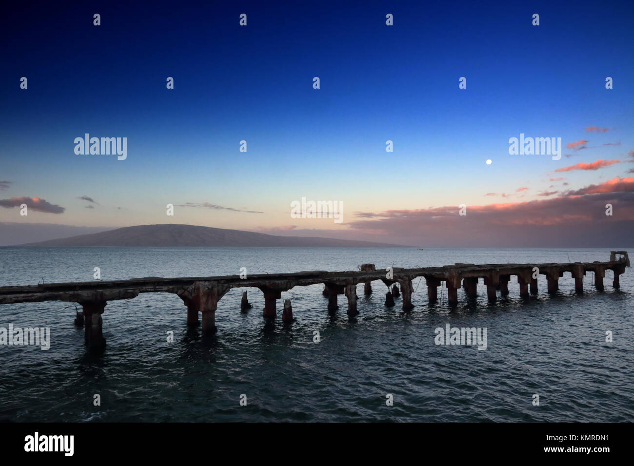 Moonset at sunrise from Mala Pier with view to Lanai on the island of ...