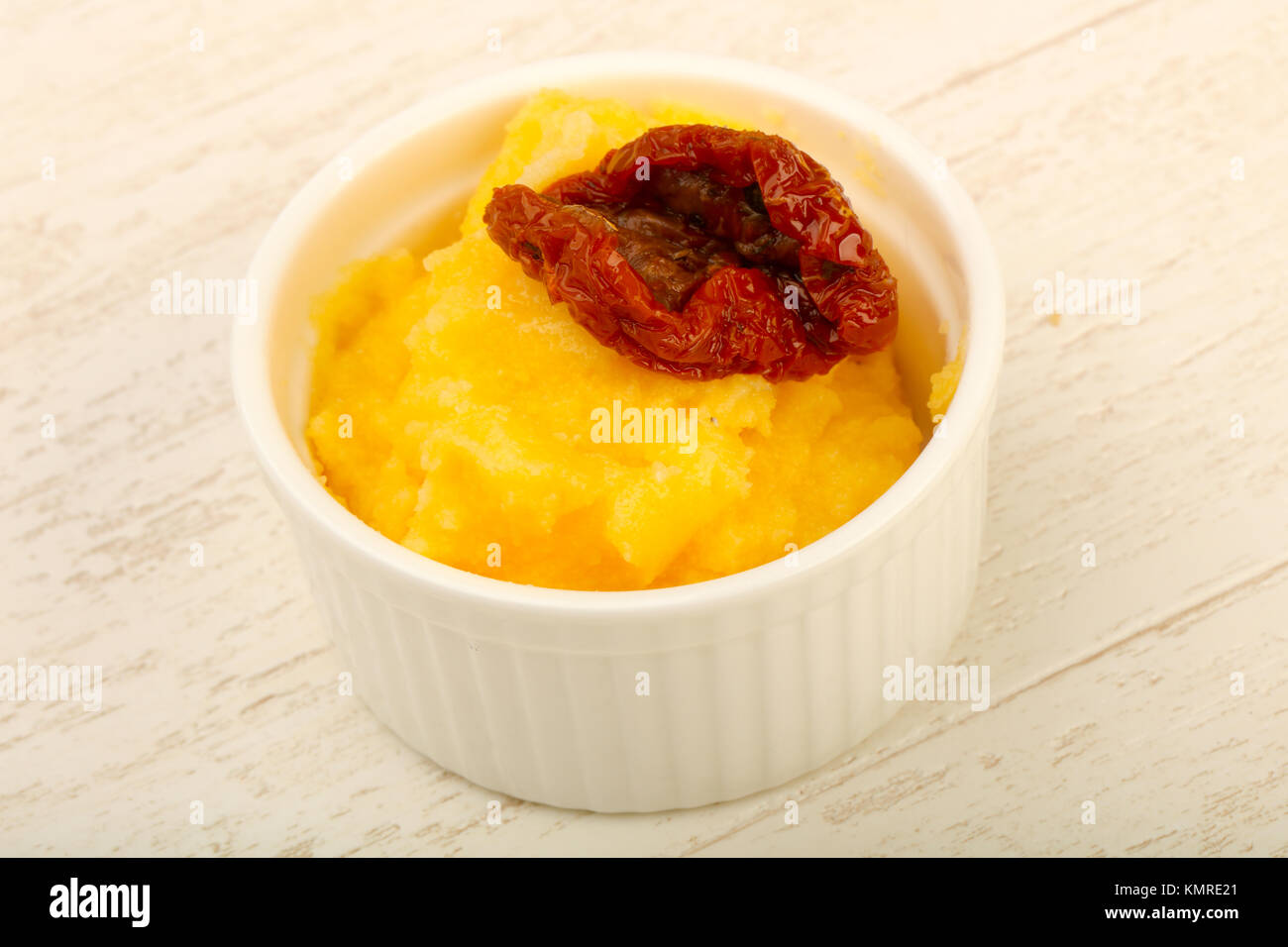 Polenta with dry tomato Stock Photo - Alamy