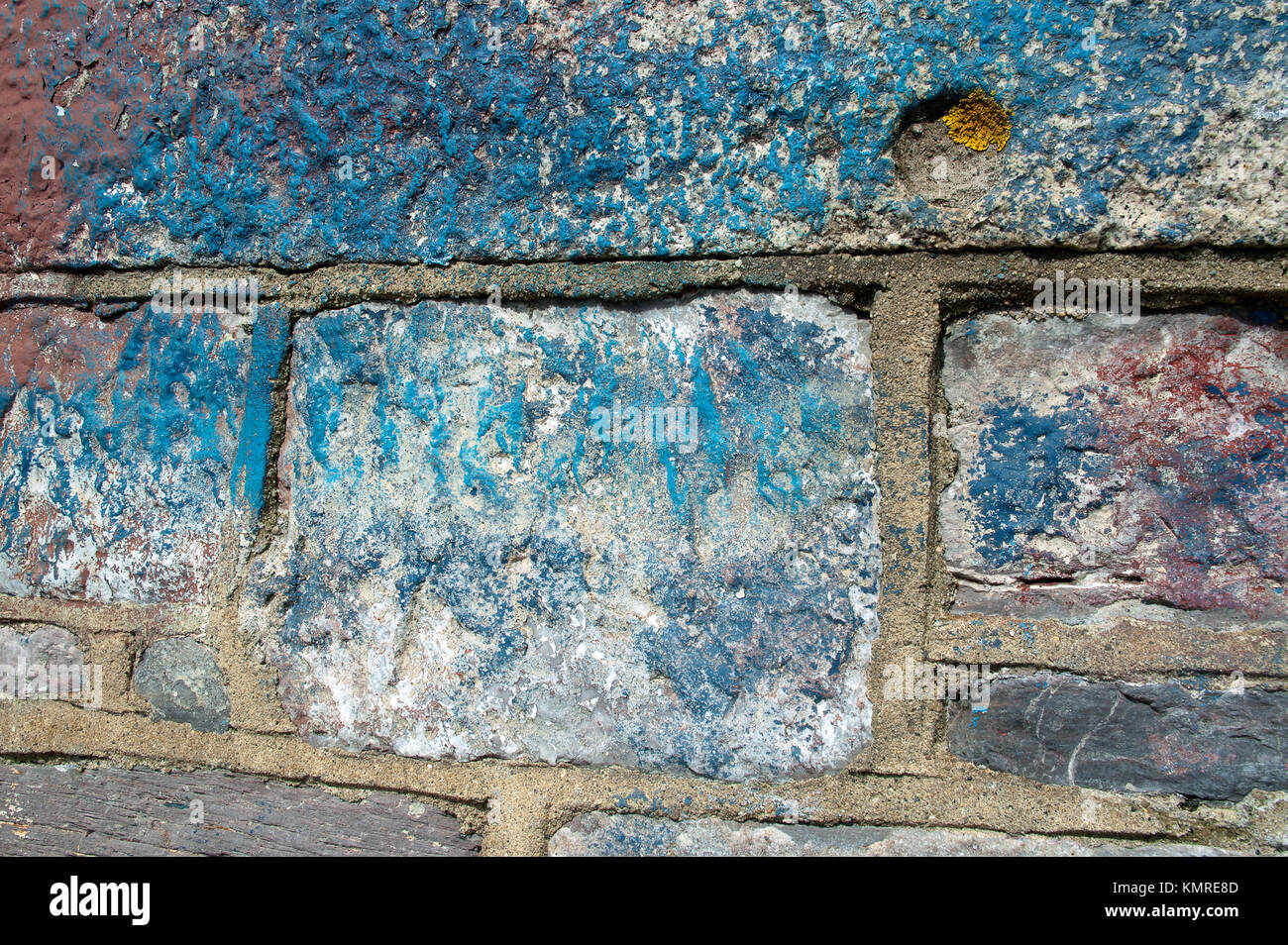 Blue painted harbour wall Stock Photo - Alamy