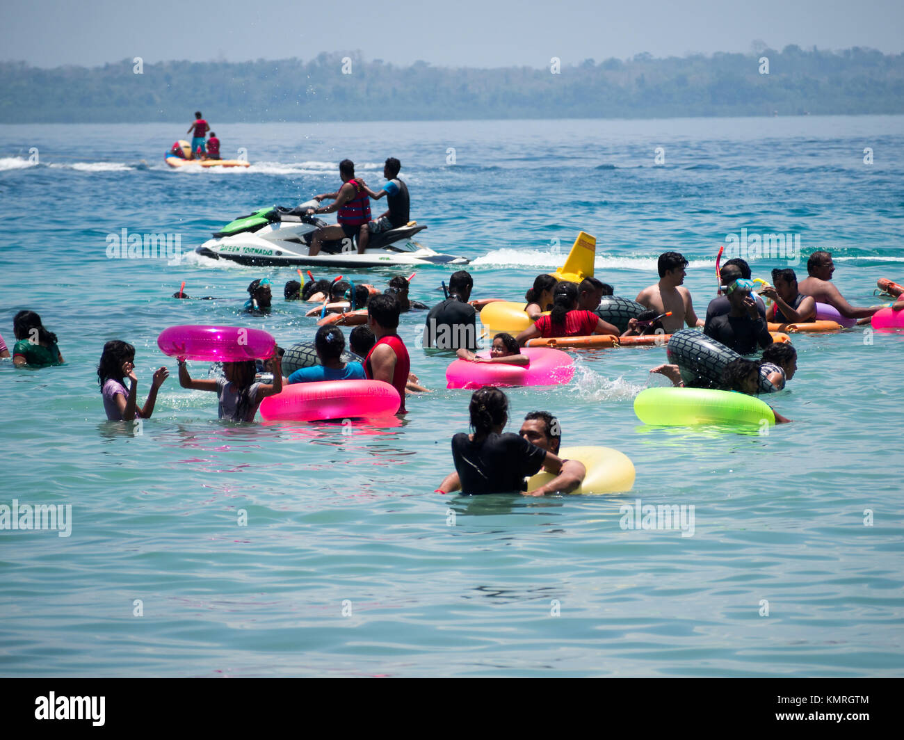 Indian tourists having fun in the sea at Elephant beach in Havelock ...
