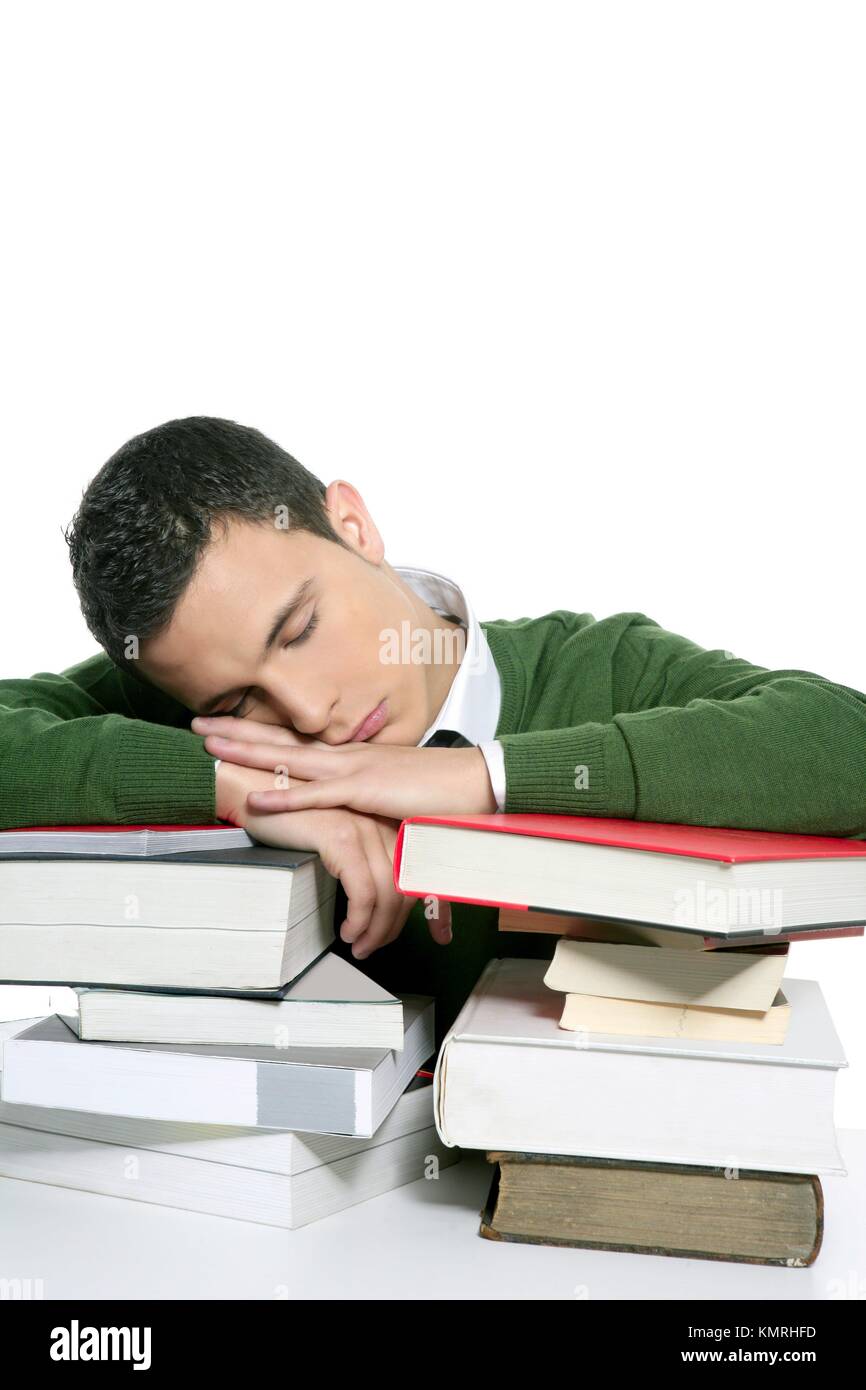 boy student sleeping over stack books over desk, green shirt and tie ...