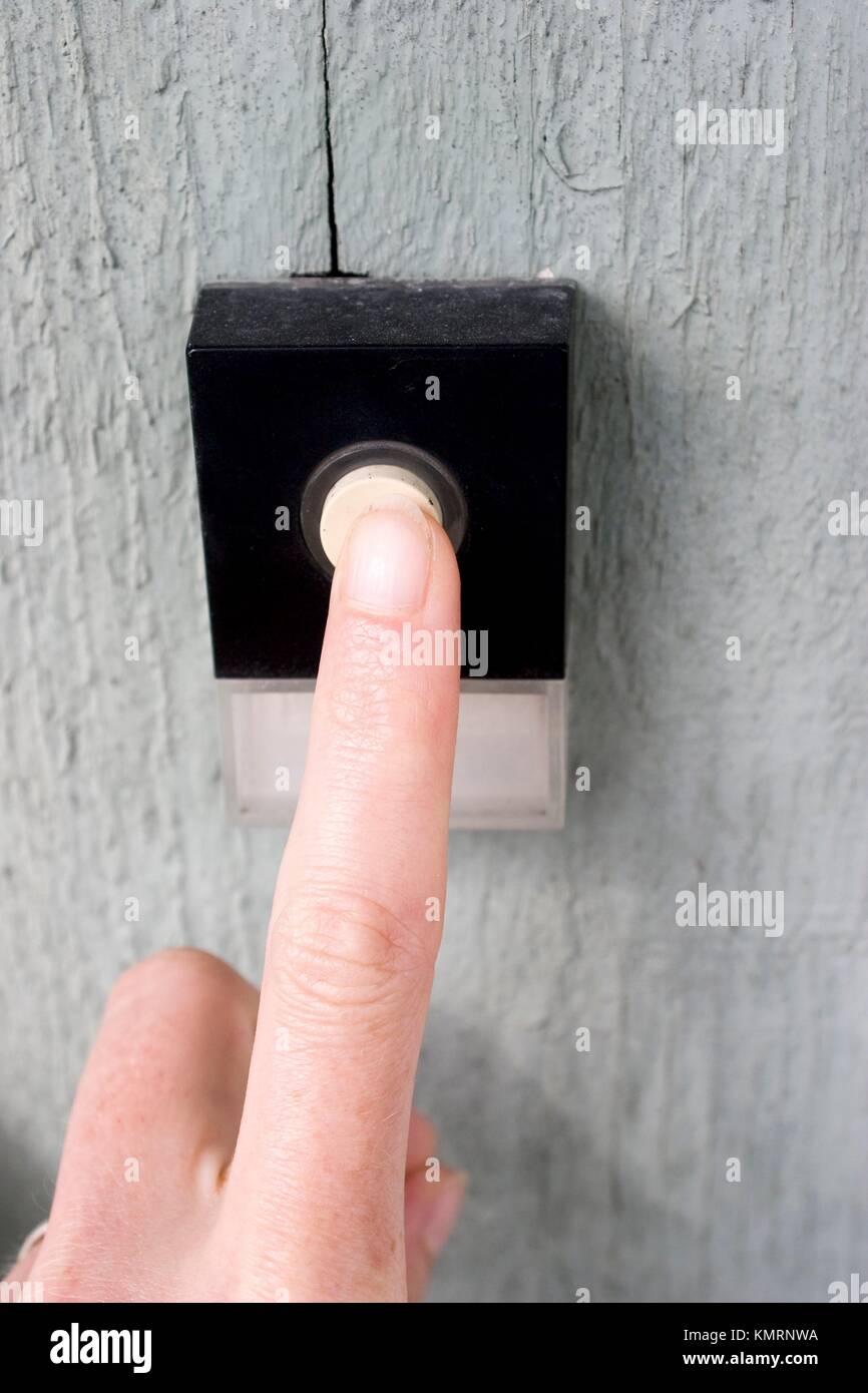 Woman ringing doorbell hi-res stock photography and images - Alamy