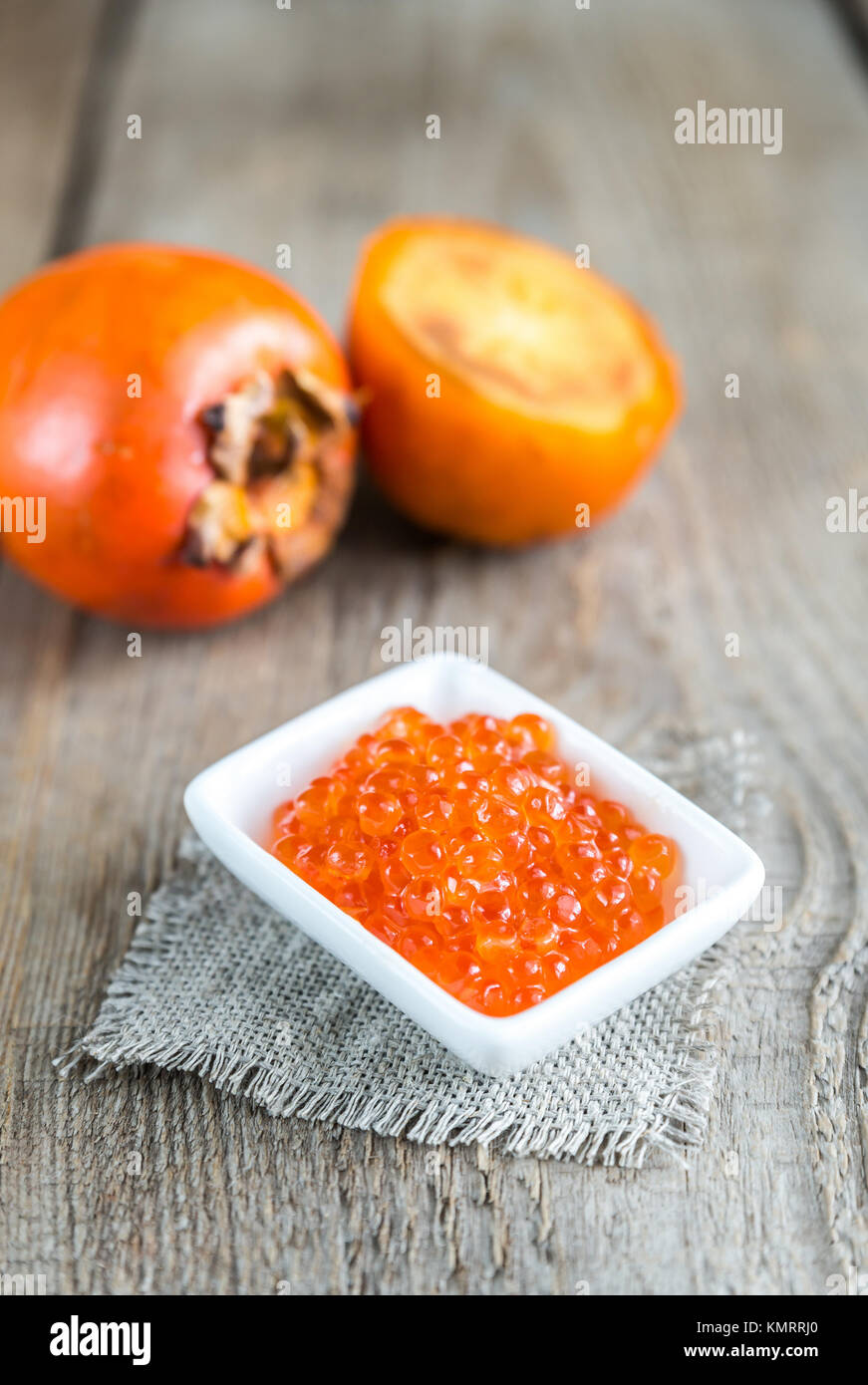 Bowl of red caviar on the wooden table Stock Photo - Alamy
