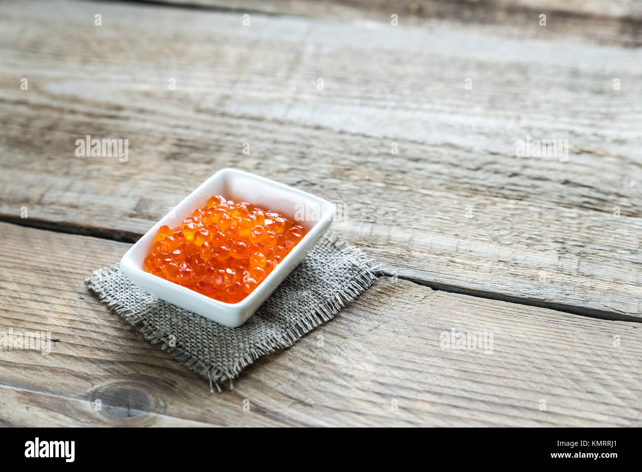 Bowl of red caviar on the wooden table Stock Photo - Alamy