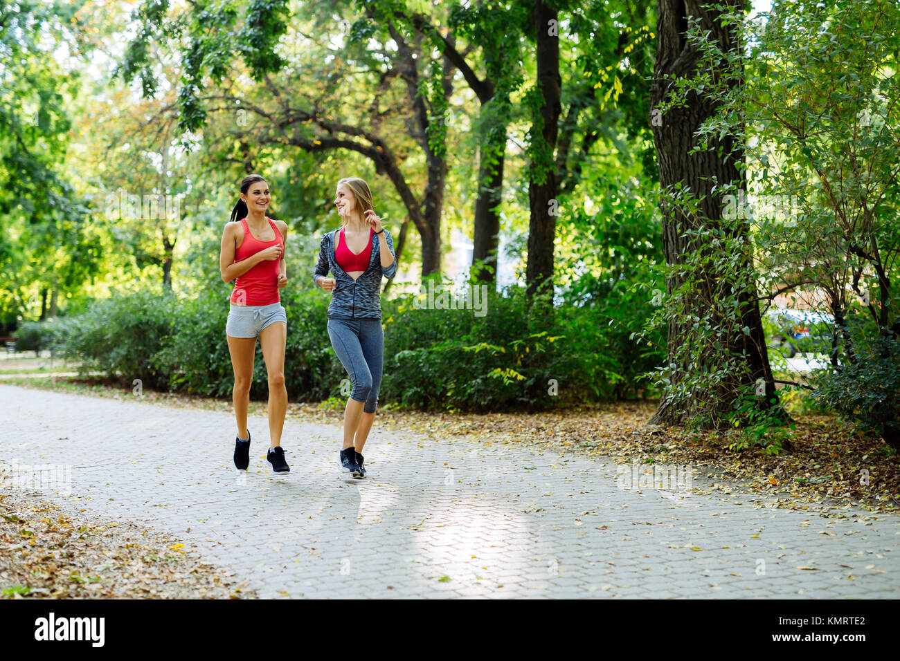Two young women jogging Stock Photo - Alamy