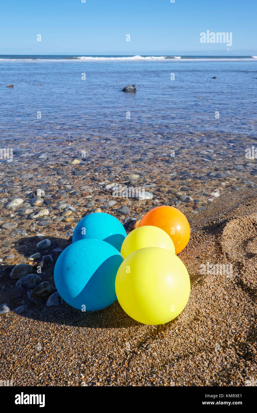 Balloons on a beach Stock Photo - Alamy