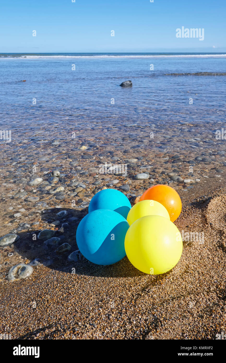 Balloons on a beach Stock Photo - Alamy