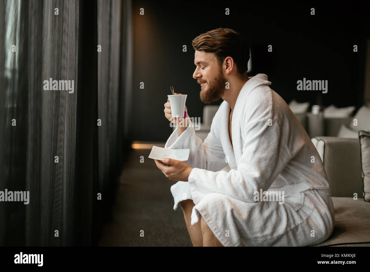 Handsome man drinking tea Stock Photo - Alamy