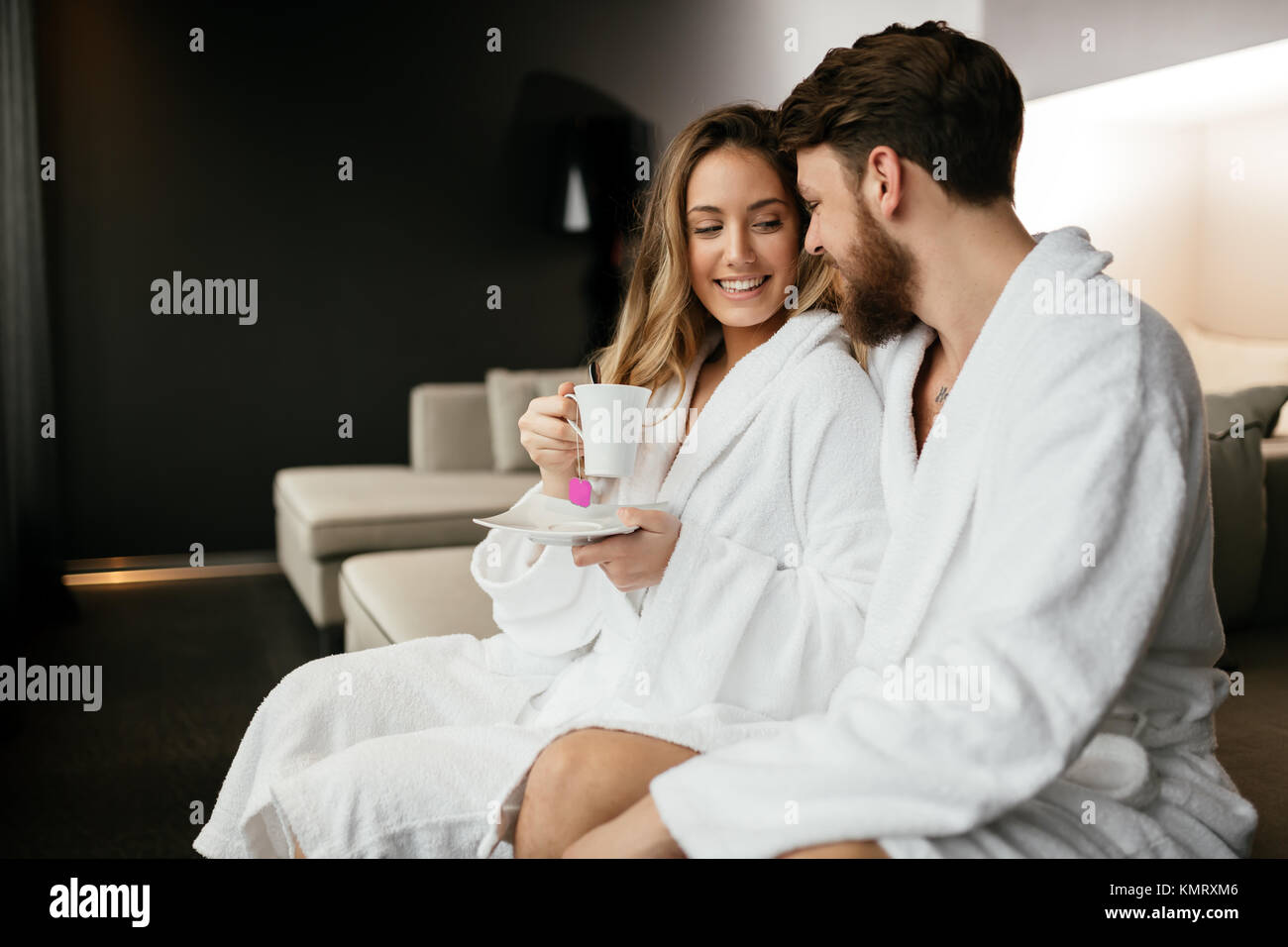 Couple enjoying morning tea Stock Photo - Alamy