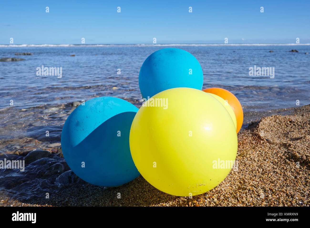Balloons on a beach Stock Photo - Alamy