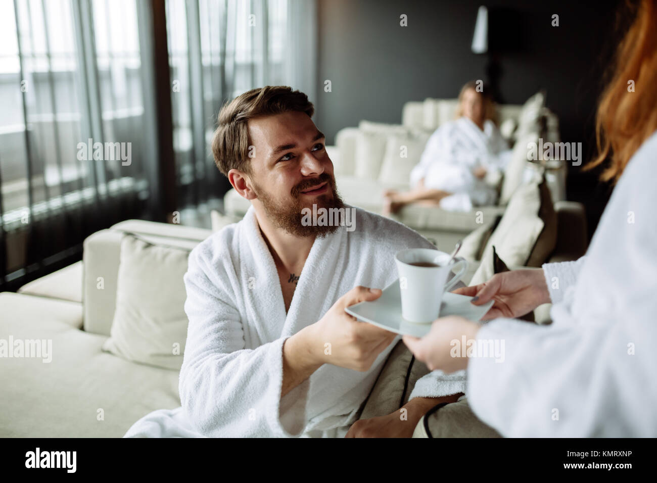 Handsome man drinking tea Stock Photo - Alamy