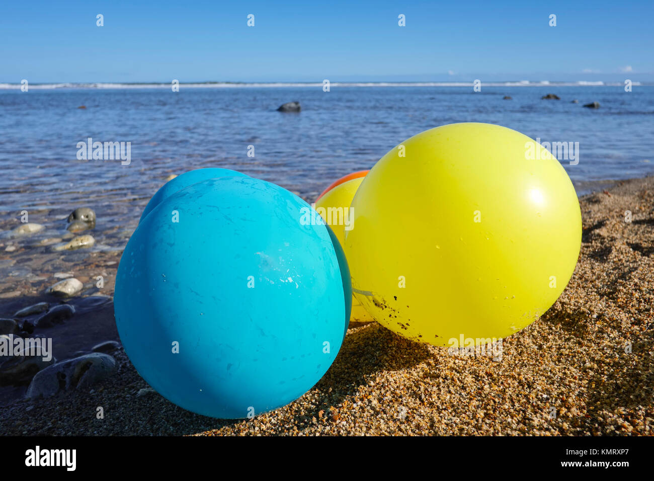 Balloons on a beach Stock Photo - Alamy