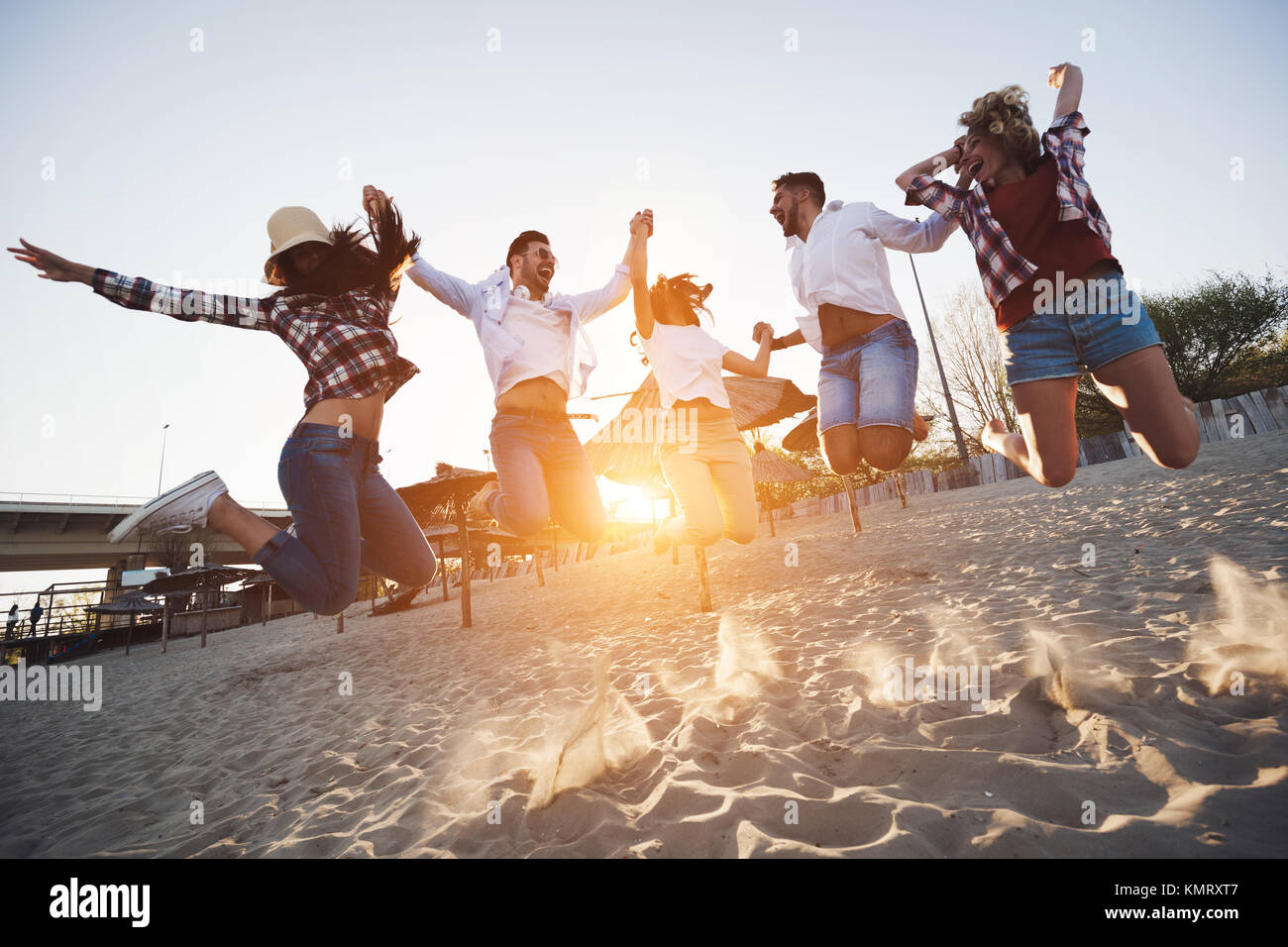 Group of happy young people enjoying summer vacation Stock Photo - Alamy