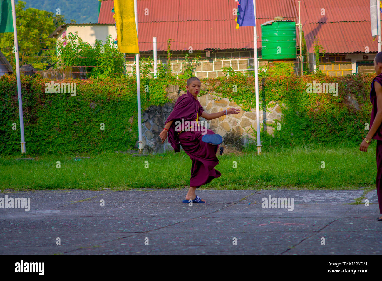 POKHARA, NEPAL - OCTOBER 06 2017: Unidentified Buddhist monk boy ...