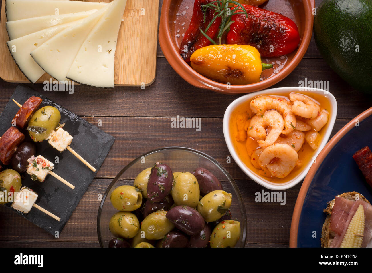 Sharing mixed spanish tapas starters on table. Top view Stock Photo - Alamy