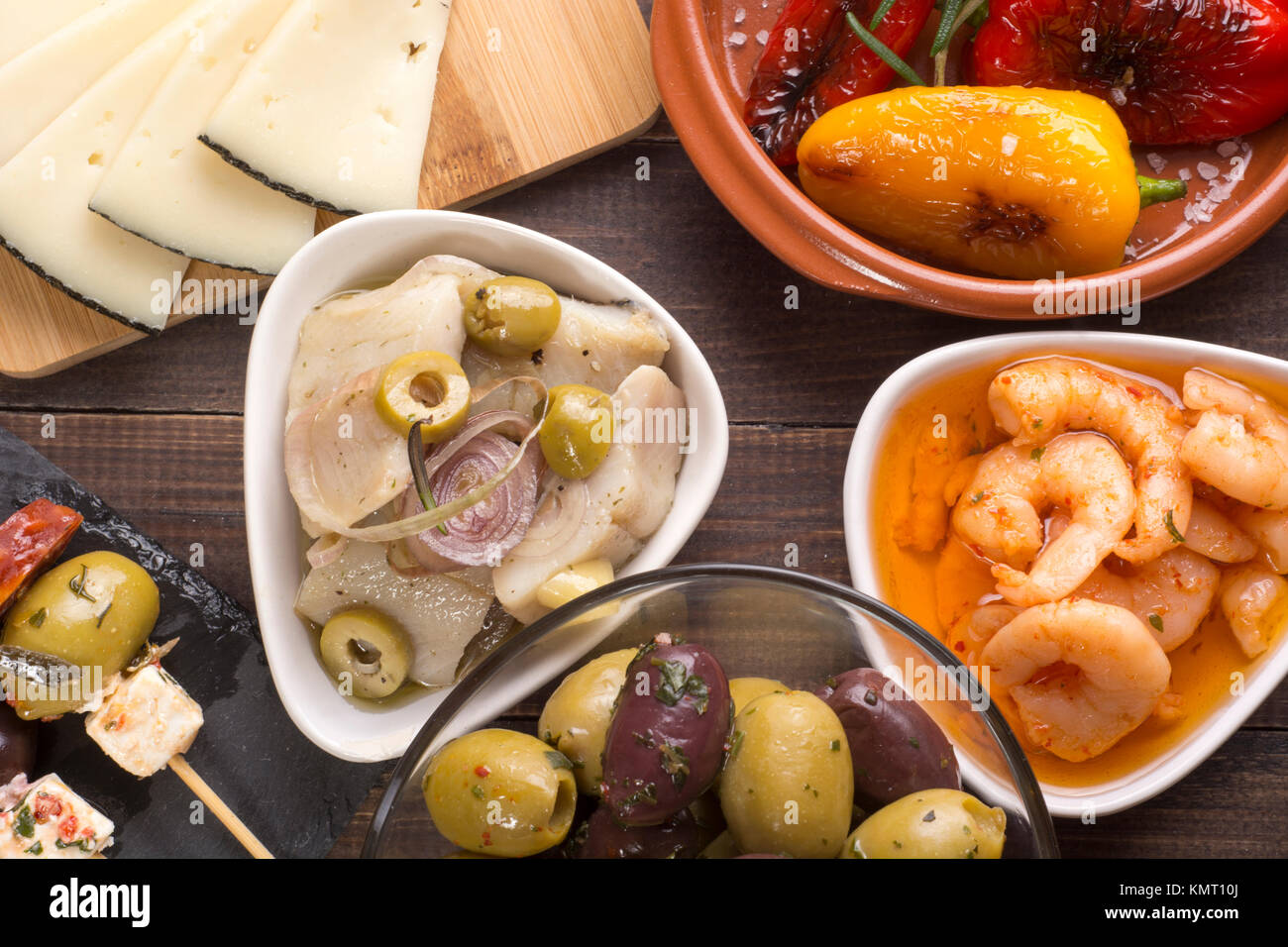 Sharing mixed spanish tapas starters on table. Top view Stock Photo - Alamy