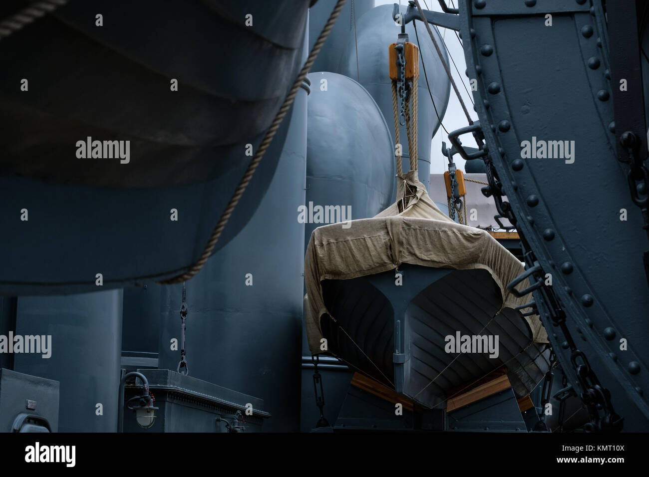 Vintage life boats on blue metal military ship Stock Photo - Alamy