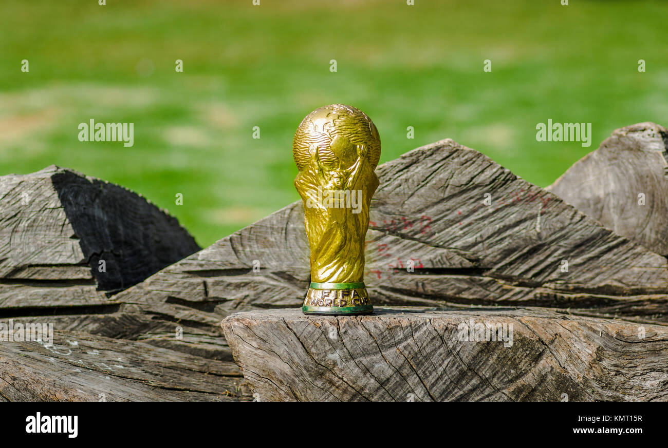 Close up of of fake golden trophy in the form of the globe, over a ...
