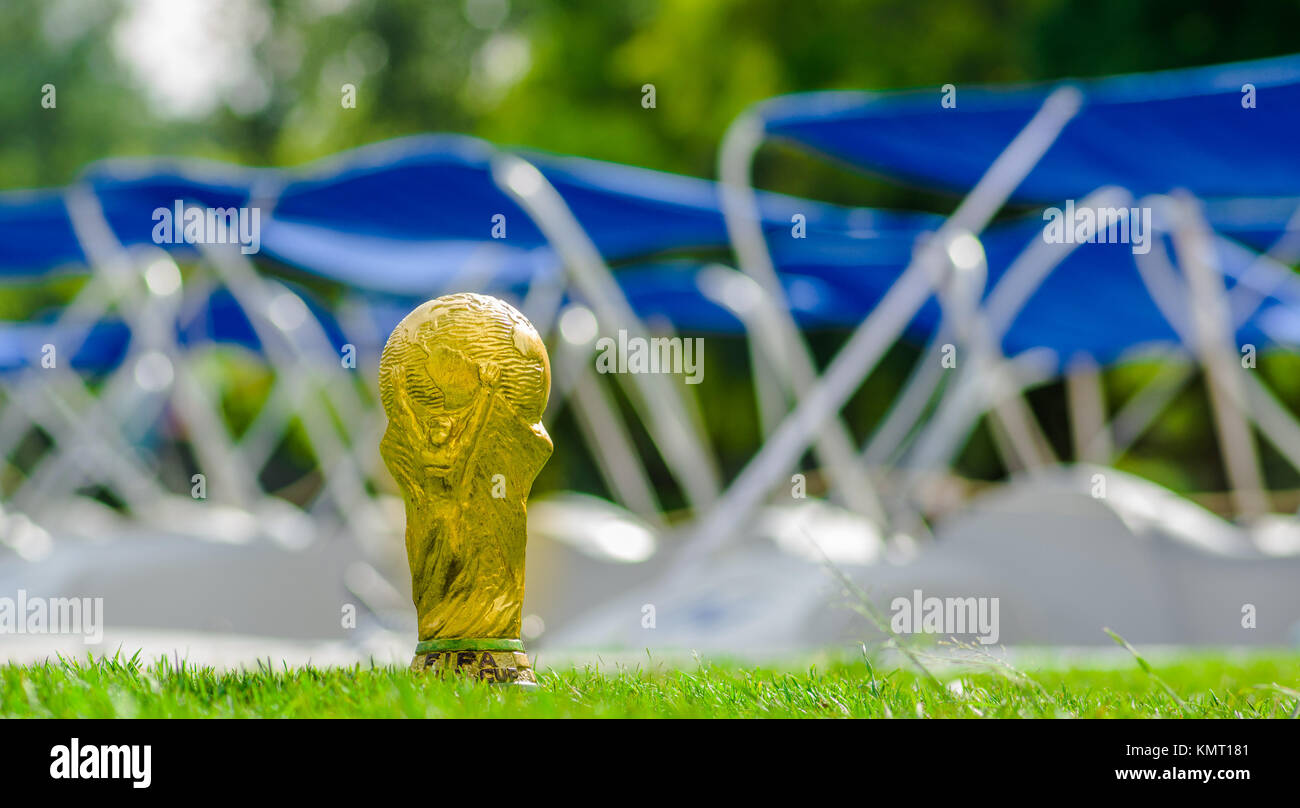 Close up of of fake golden trophy in the form of the globe in the park ...