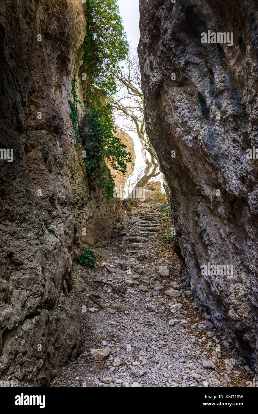 The passage between the rocks in the canyon crevice. Path to the light ...